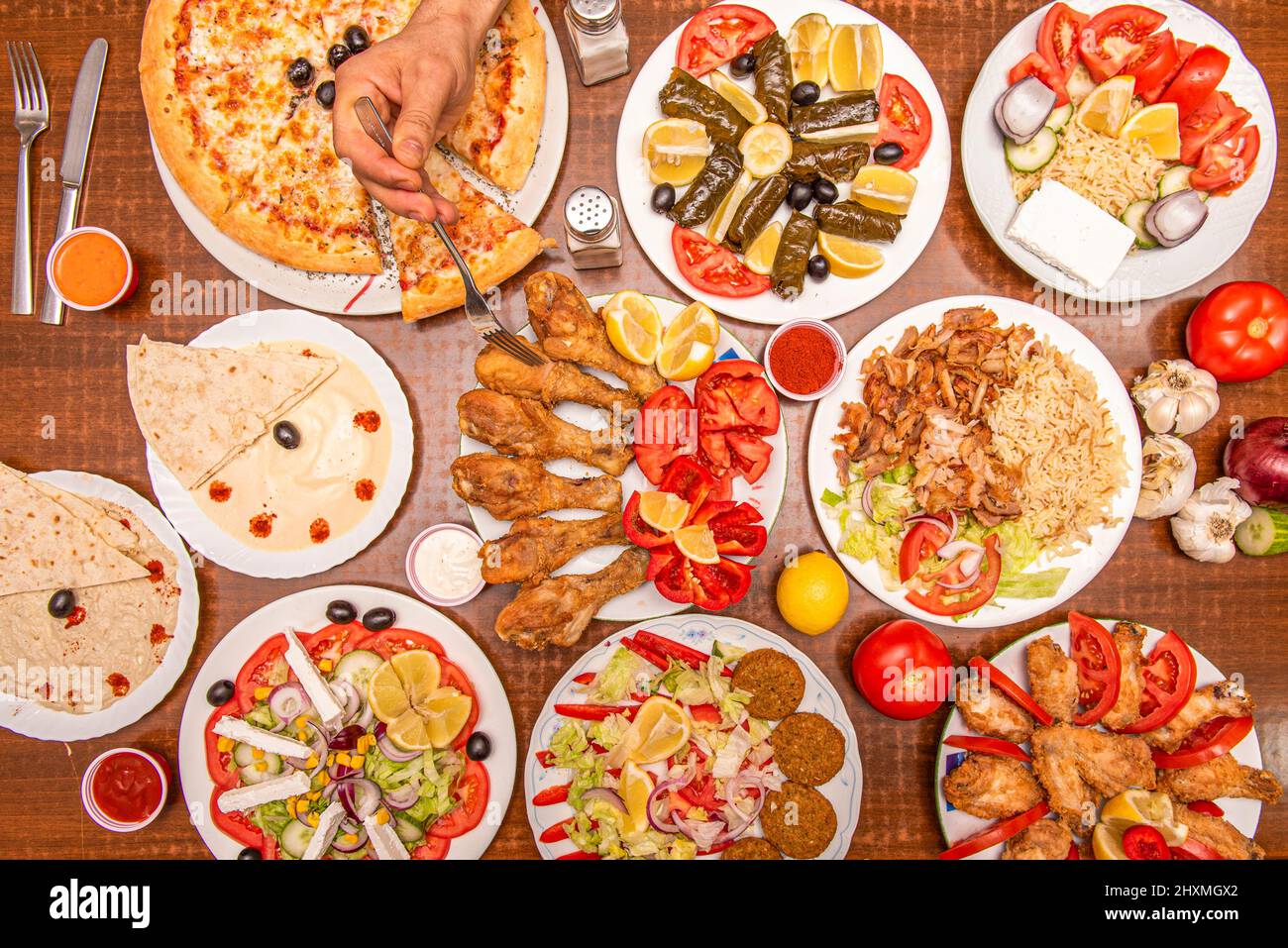 Set of dishes with Asian, Arabic and Mediterranean food with fried ...