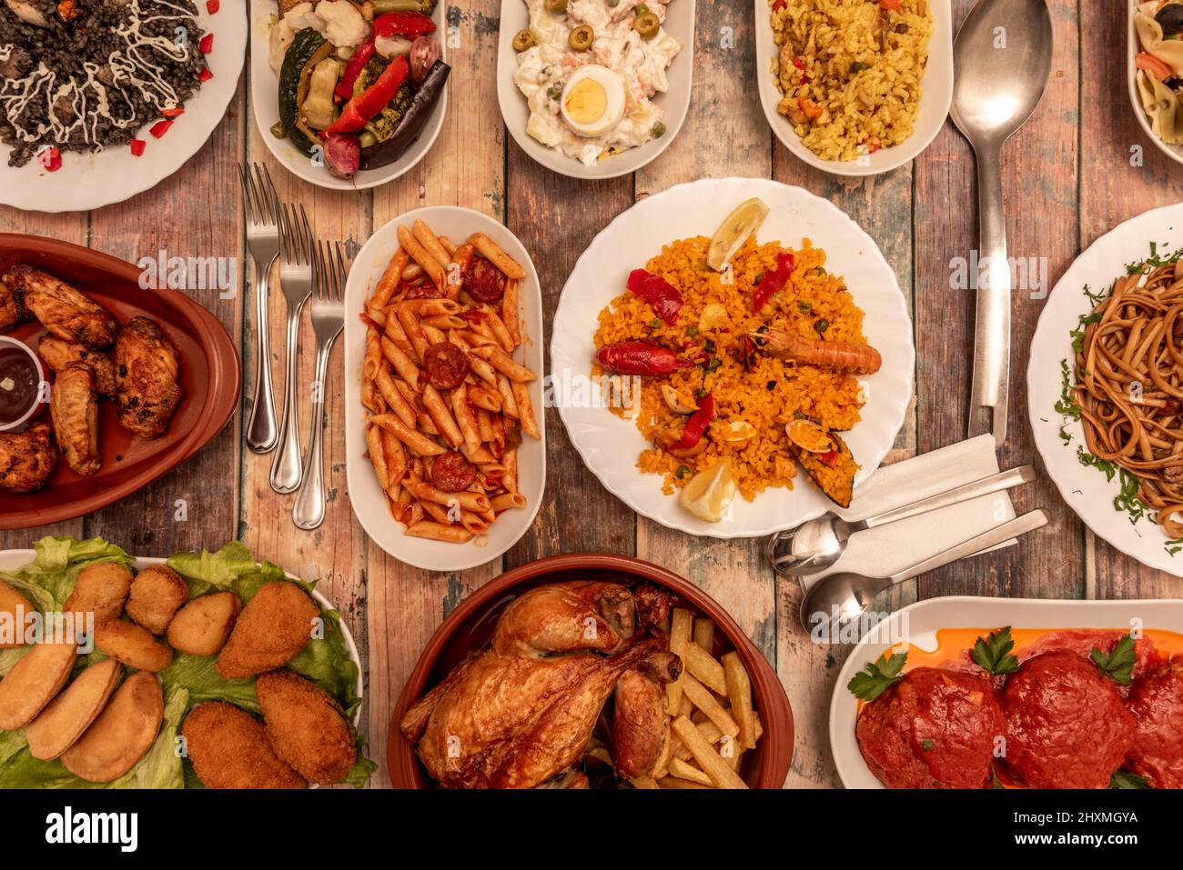 Set of assorted dishes of Spanish food macaroni with tomato and chorizo ...