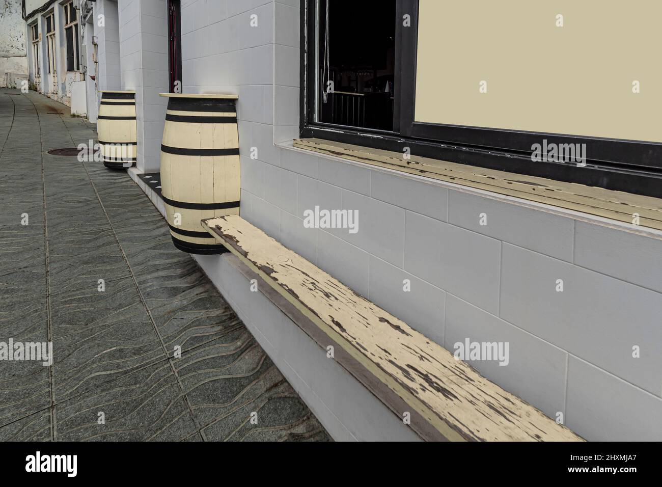 Decorative beer keg on an empty business facade Stock Photo - Alamy