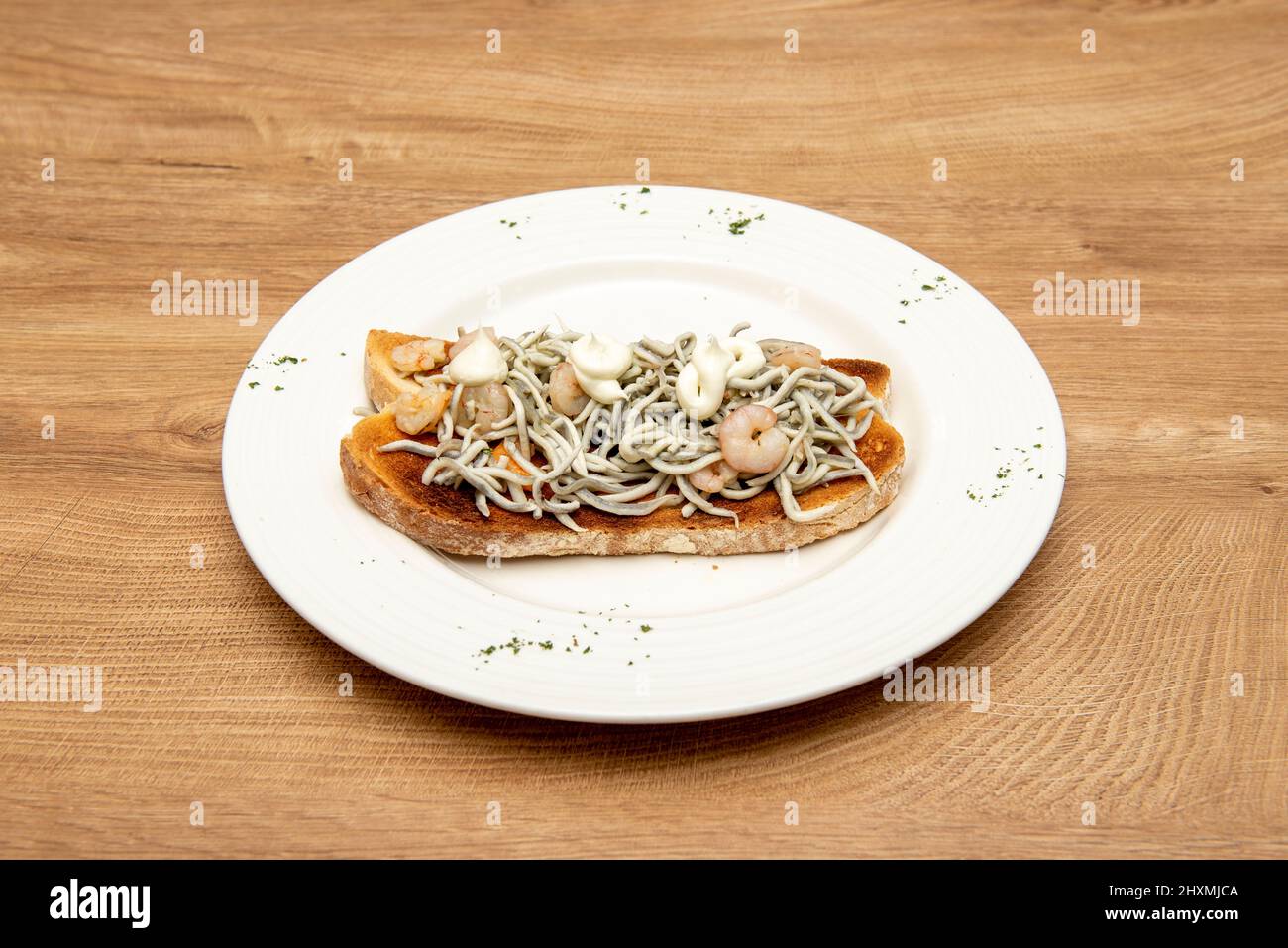 wonderful eel and prawn toasts with garlic as appetizers or starters ...
