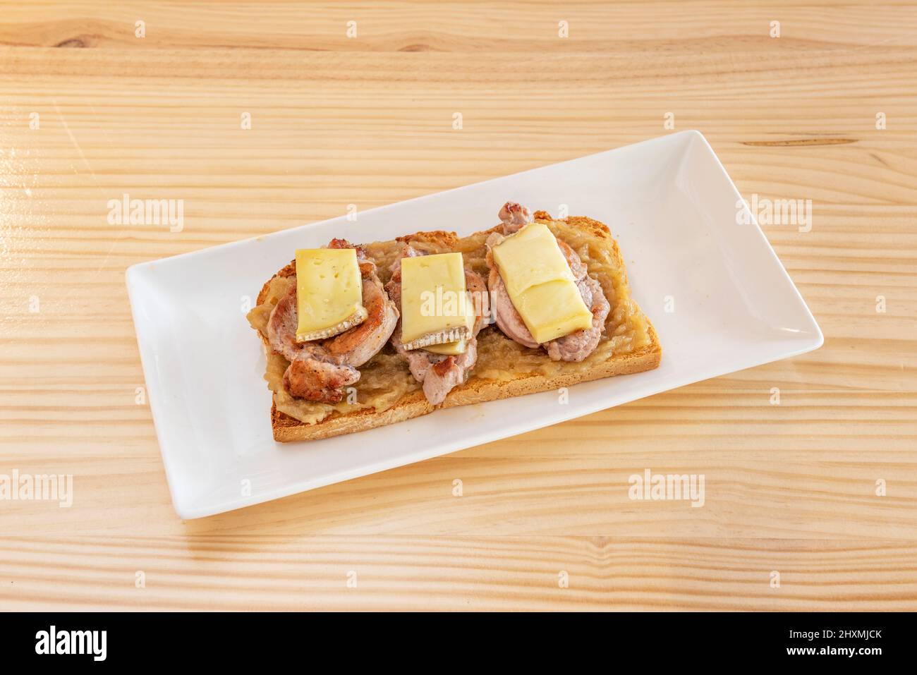 Iberian secret toast with tomato jam and Manchego cheese with crispy ...