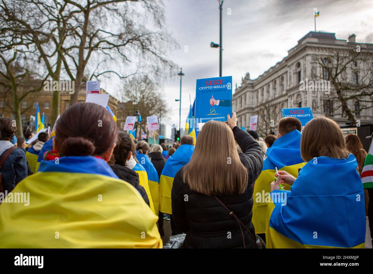 Protesters hold placards expressing their opinion during the ...