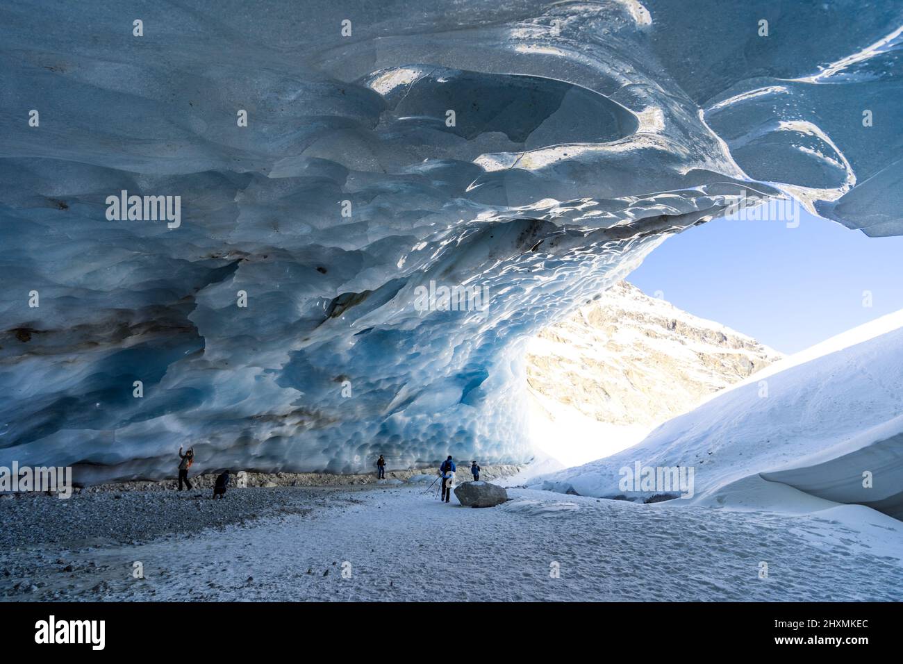Hikers with snowshoes in Zinal glacier cave in Switzerland Stock Photo ...