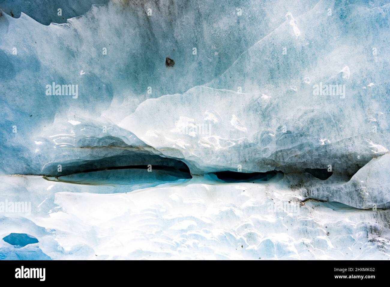 Breaking ice in glacier, ice wall texture taken from a natural glacier ...
