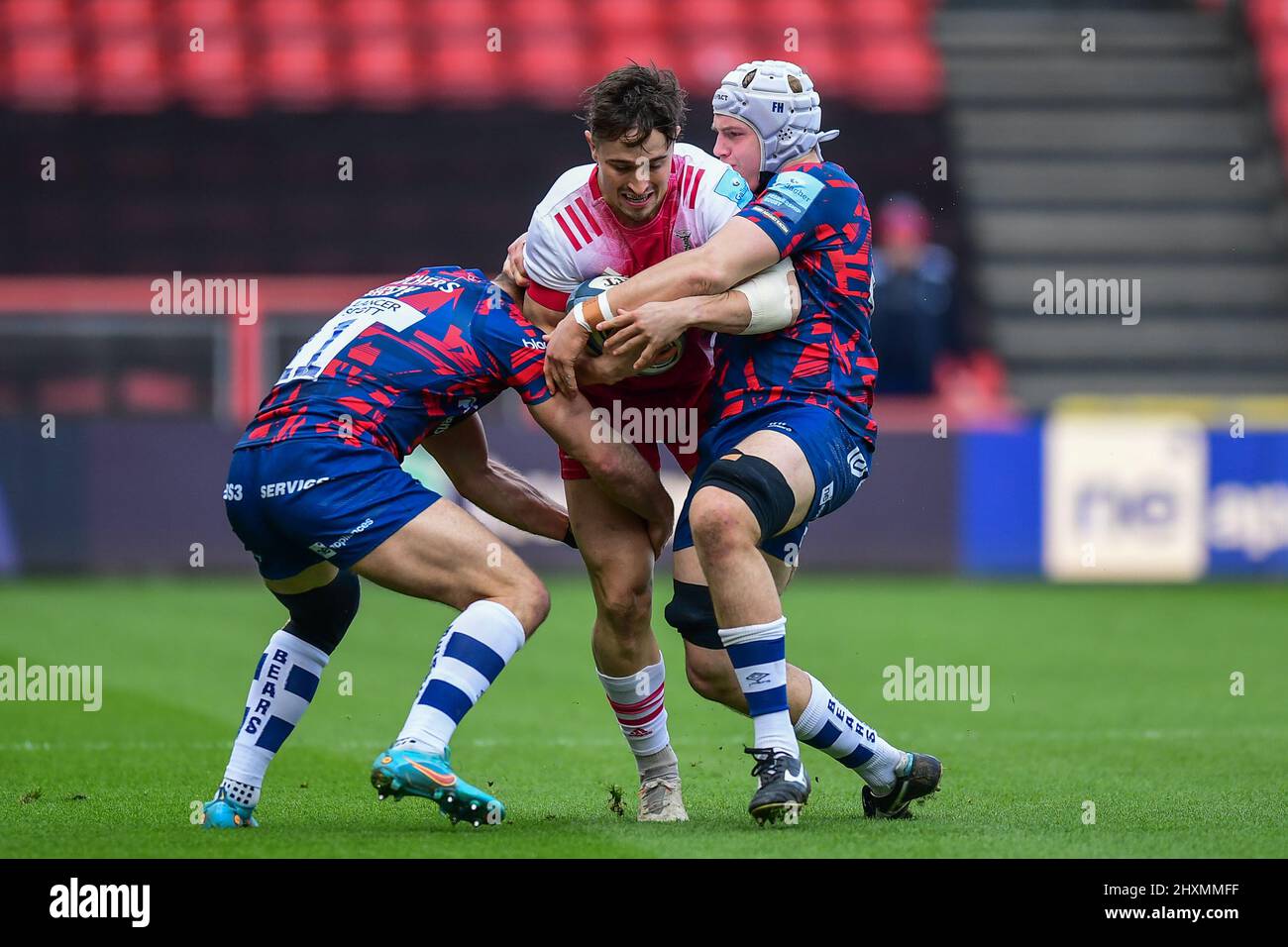 Cadan Murley of Harlequins Rugby, tackled by Fitz Harding of Rugby ...