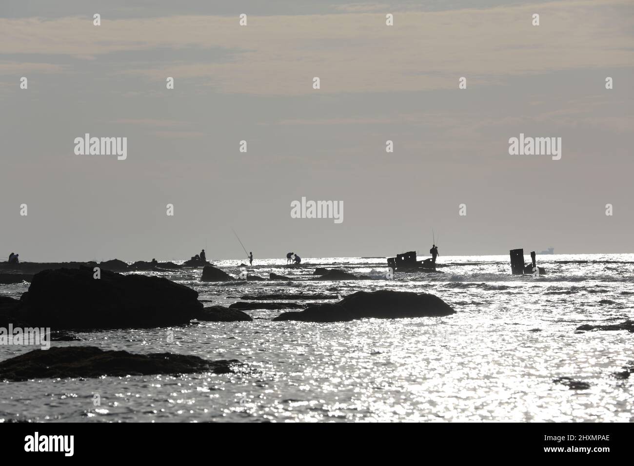 View along shoreline showing slab shelves of lava sand rock and pools ...