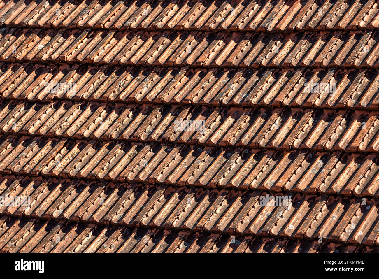 Red Roof tiles. Tile roof of a old house. Tile roofs used in old and ...
