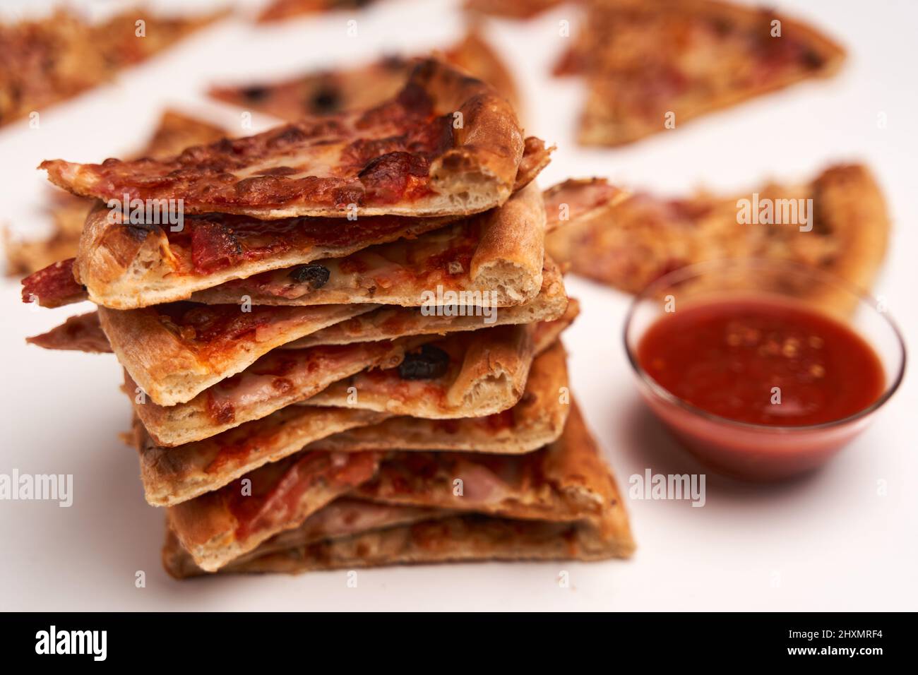 Stack of pizza slices isolated on white background Stock Photo - Alamy