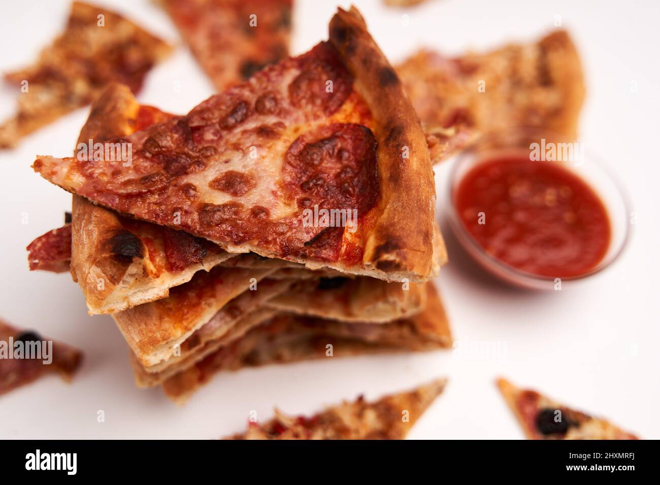 Stack of pizza slices isolated on white background Stock Photo - Alamy