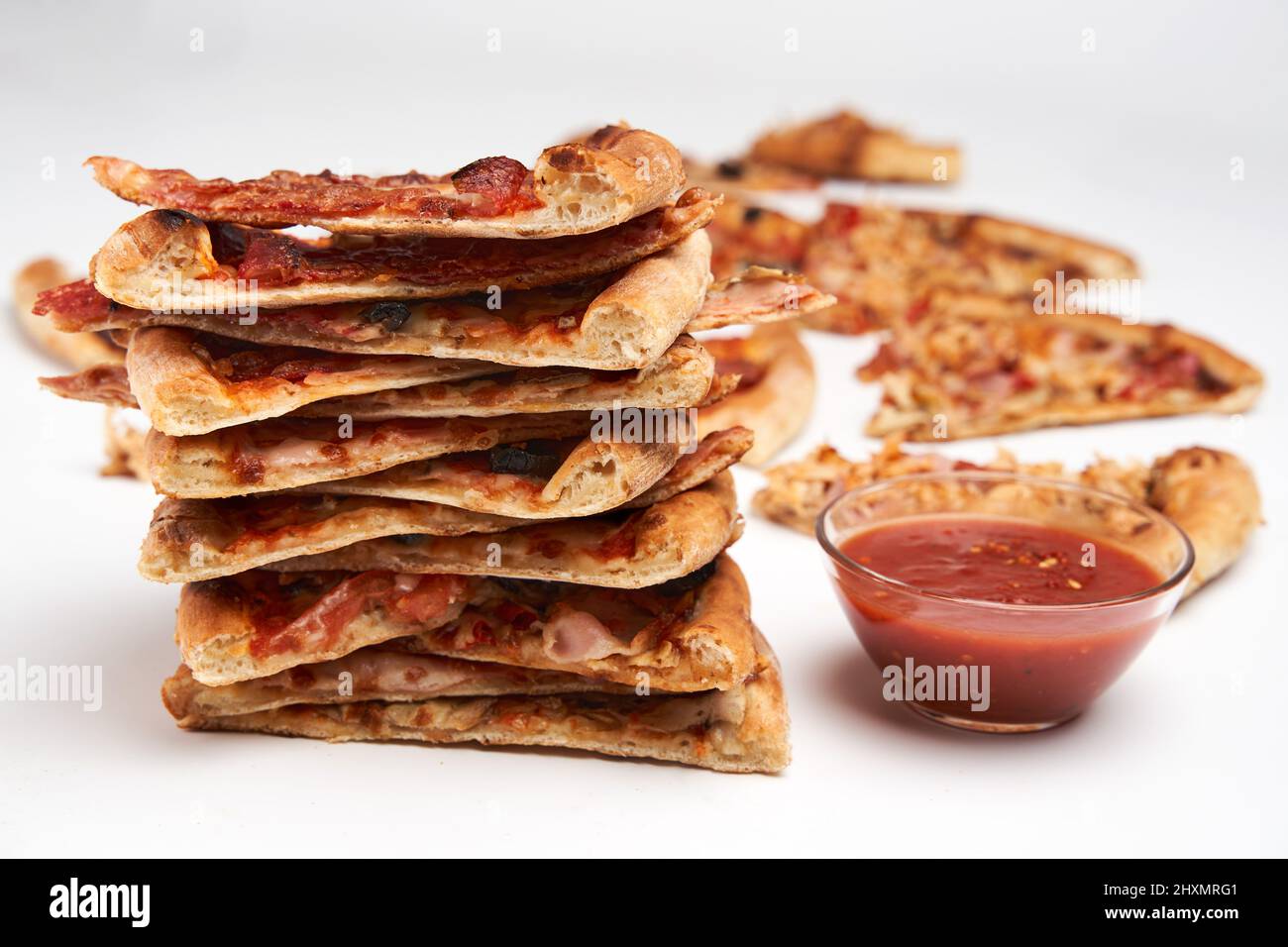 Stack of pizza slices isolated on white background Stock Photo - Alamy