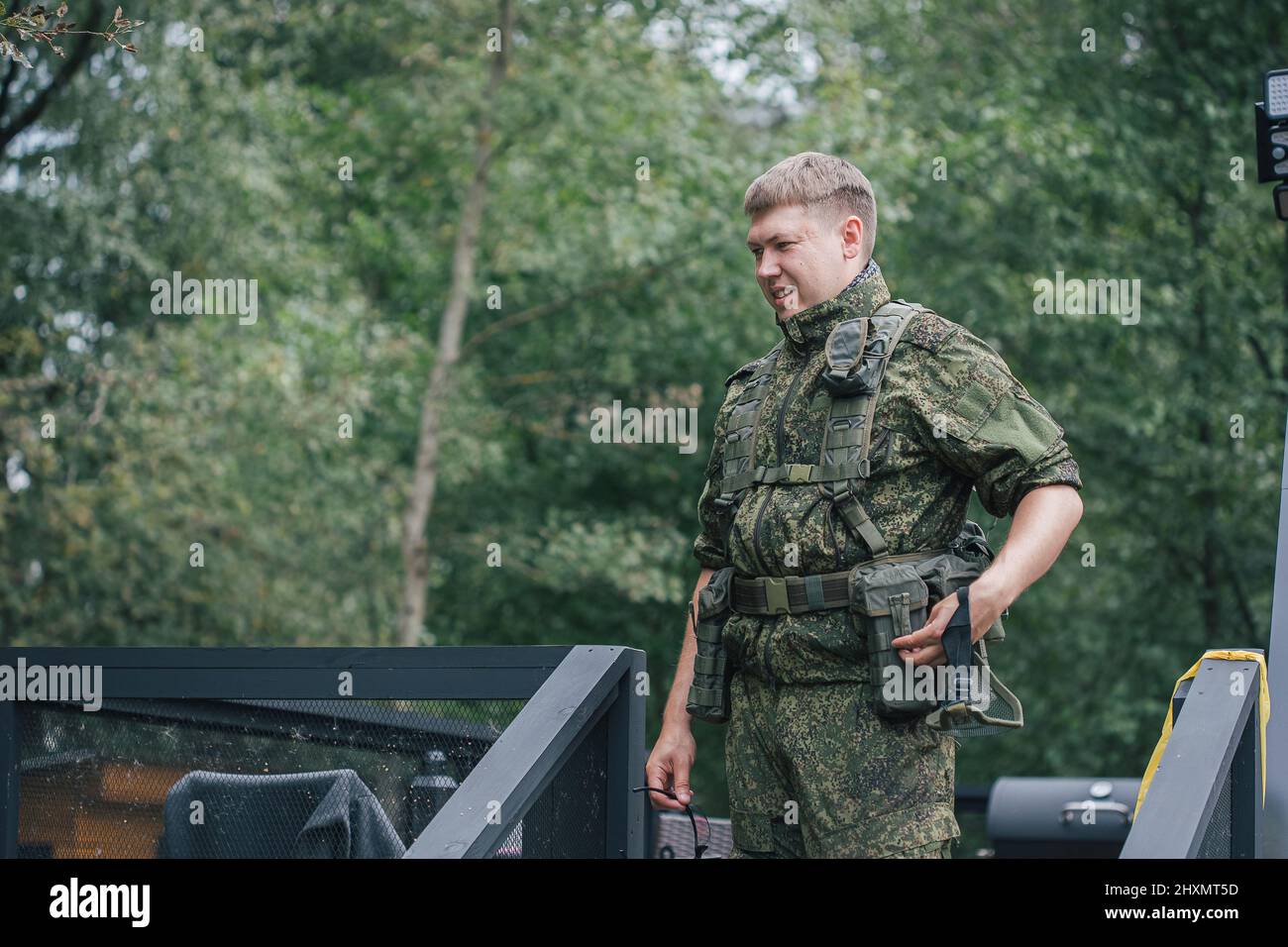Fully equipped military men with automatic weapons getting ready to ...