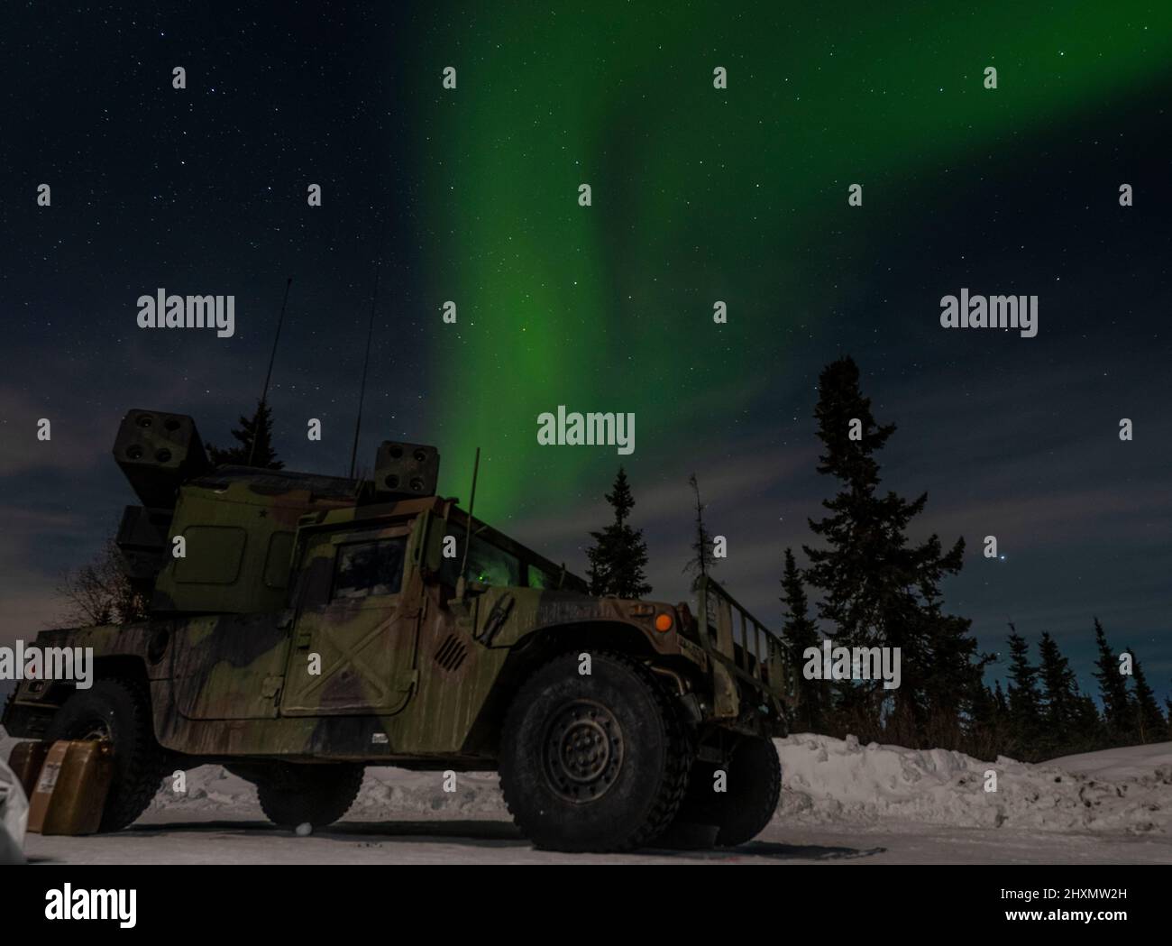 The northern lights glow above an Avenger Air Defense System assigned ...