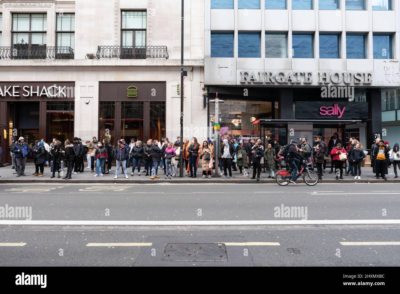 Passengers looking for alternative means of transport gather around a ...