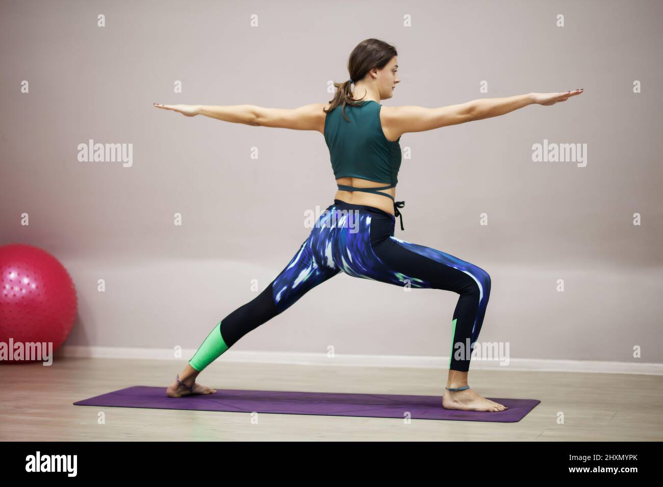 Fitness instructor practicing yoga. Fit girl exercise stretching poses ...