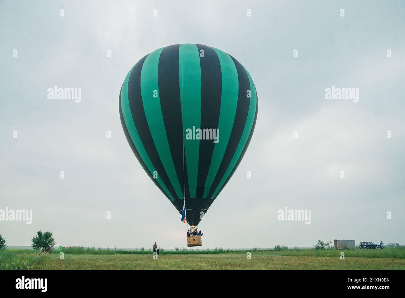 Inflating, unpack and flying up hot air balloon watermelon. Burner ...