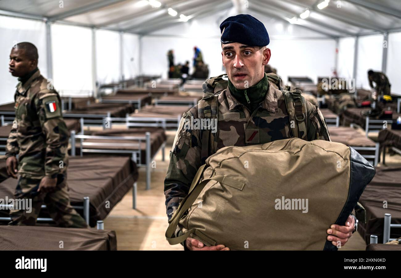 French soldiers move their belongings to living quarters at Mihail ...