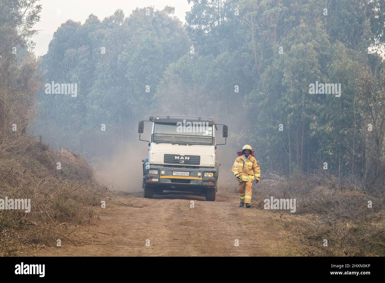Nakuru, Kenya - 13 Mar 2022 , A fire fighter arrives to try to contain ...