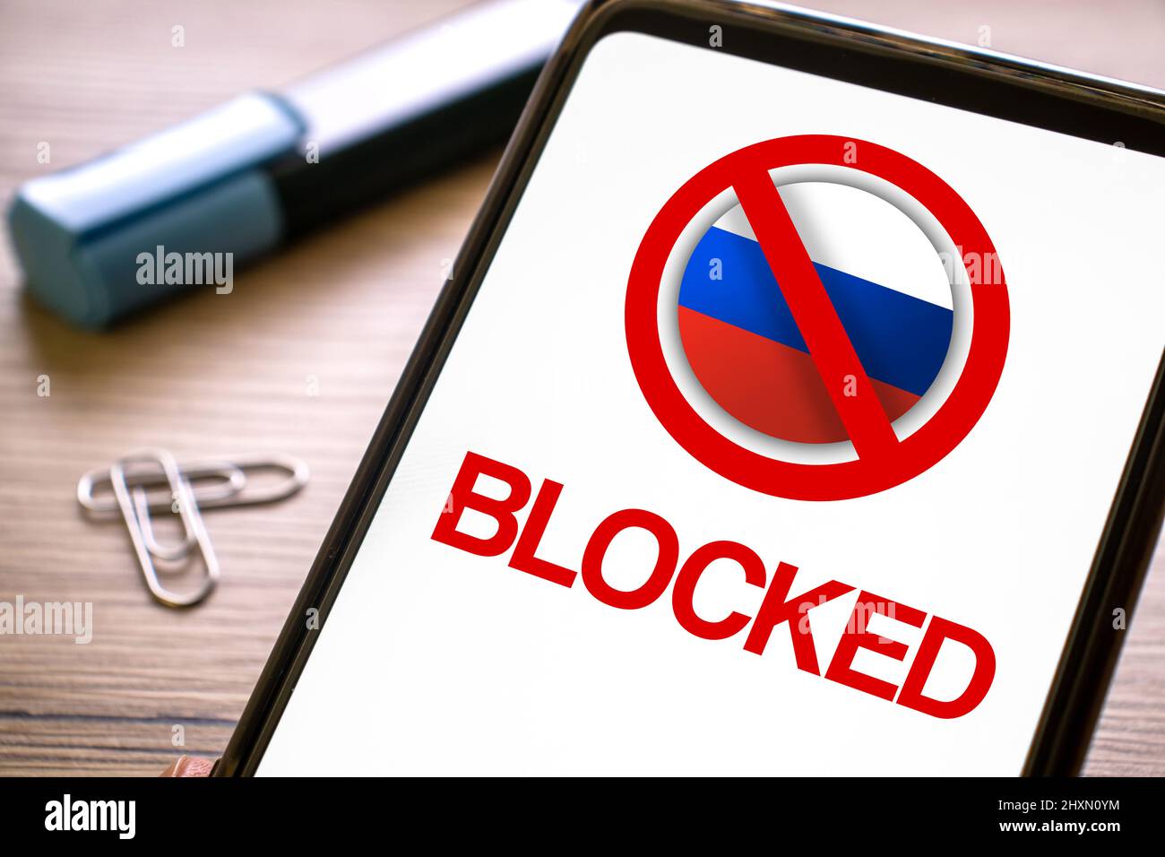 Russia flag red block symbol on smartphone for ban sanctions of the war ...