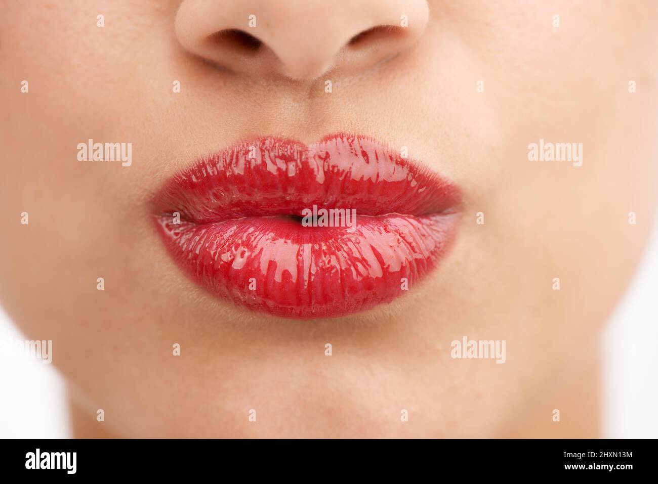 A glossy red pout. Cropped closeup shot of a young woman pouting Stock ...