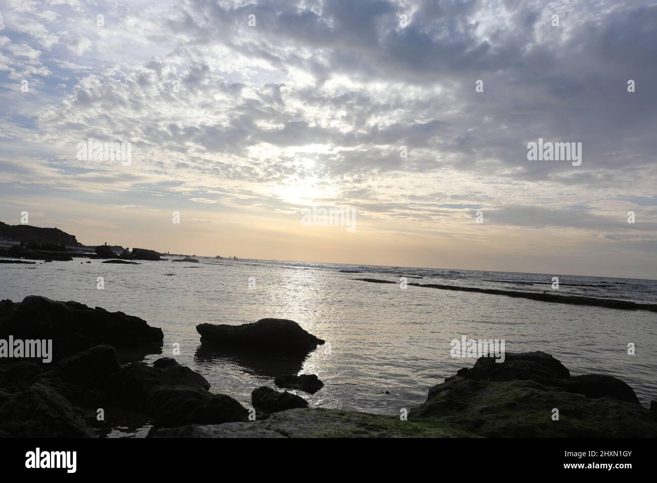 Vivid sunset over ocean with clouds High quality Stock Photo - Alamy