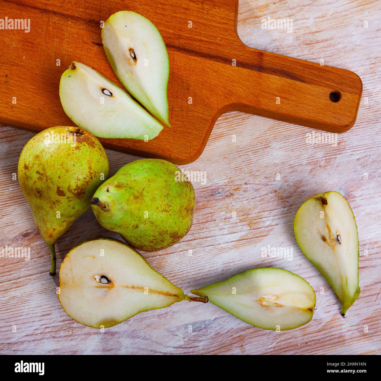 Whole pears with chopped slices Stock Photo - Alamy