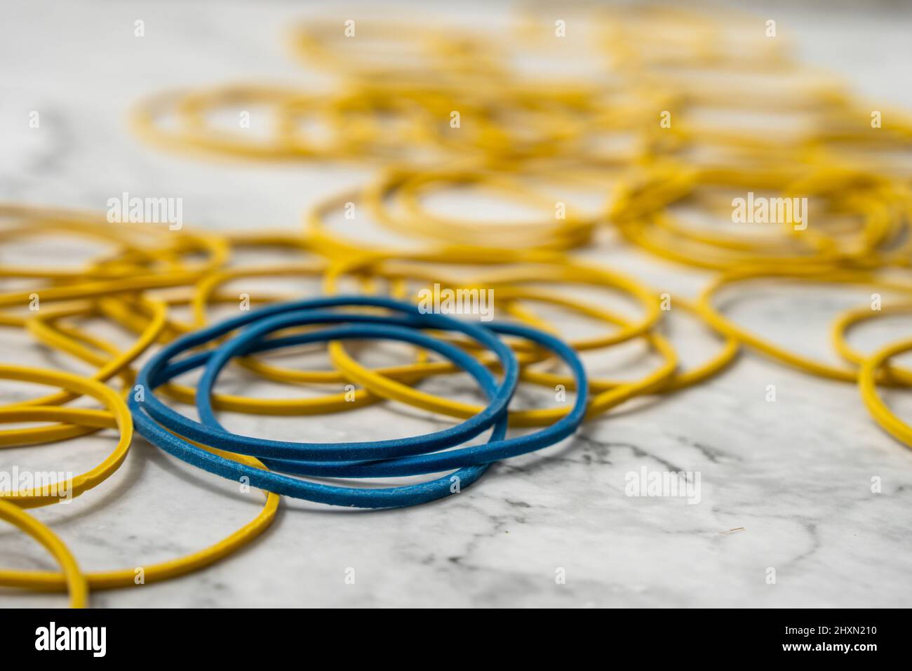 Yellow rubber bands hi-res stock photography and images - Alamy