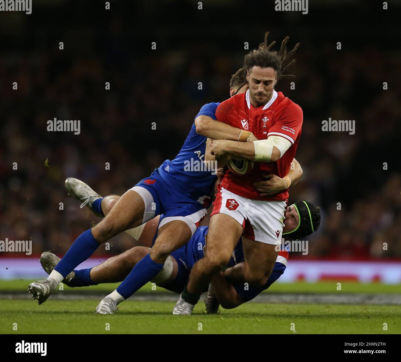 Josh Navidi of Wales is stopped by Romain NTamack of France (l) and ...