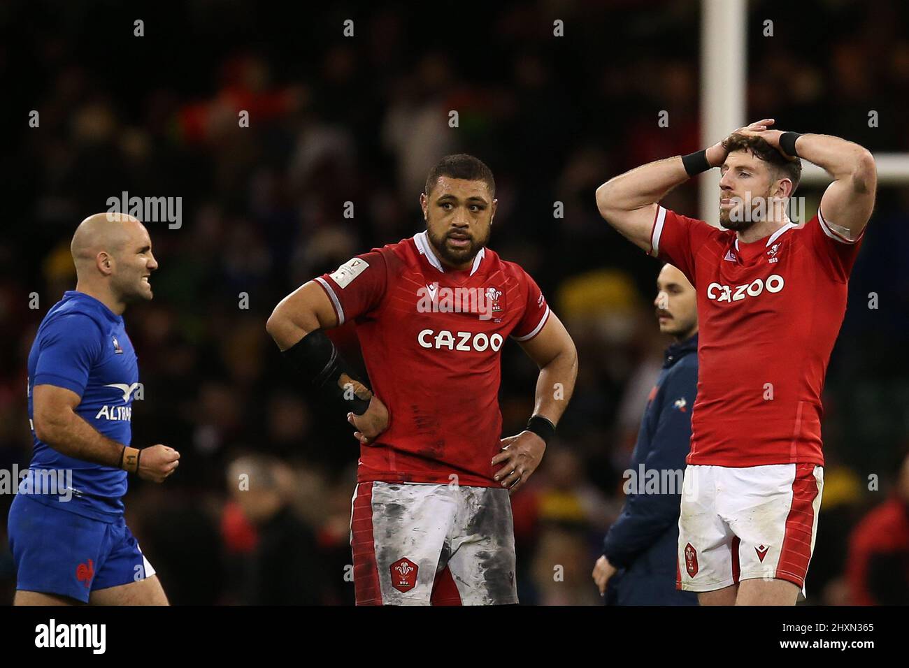 Taulupe Faletau of Wales (c) and Alex Cuthbert of Wales (r) look ...