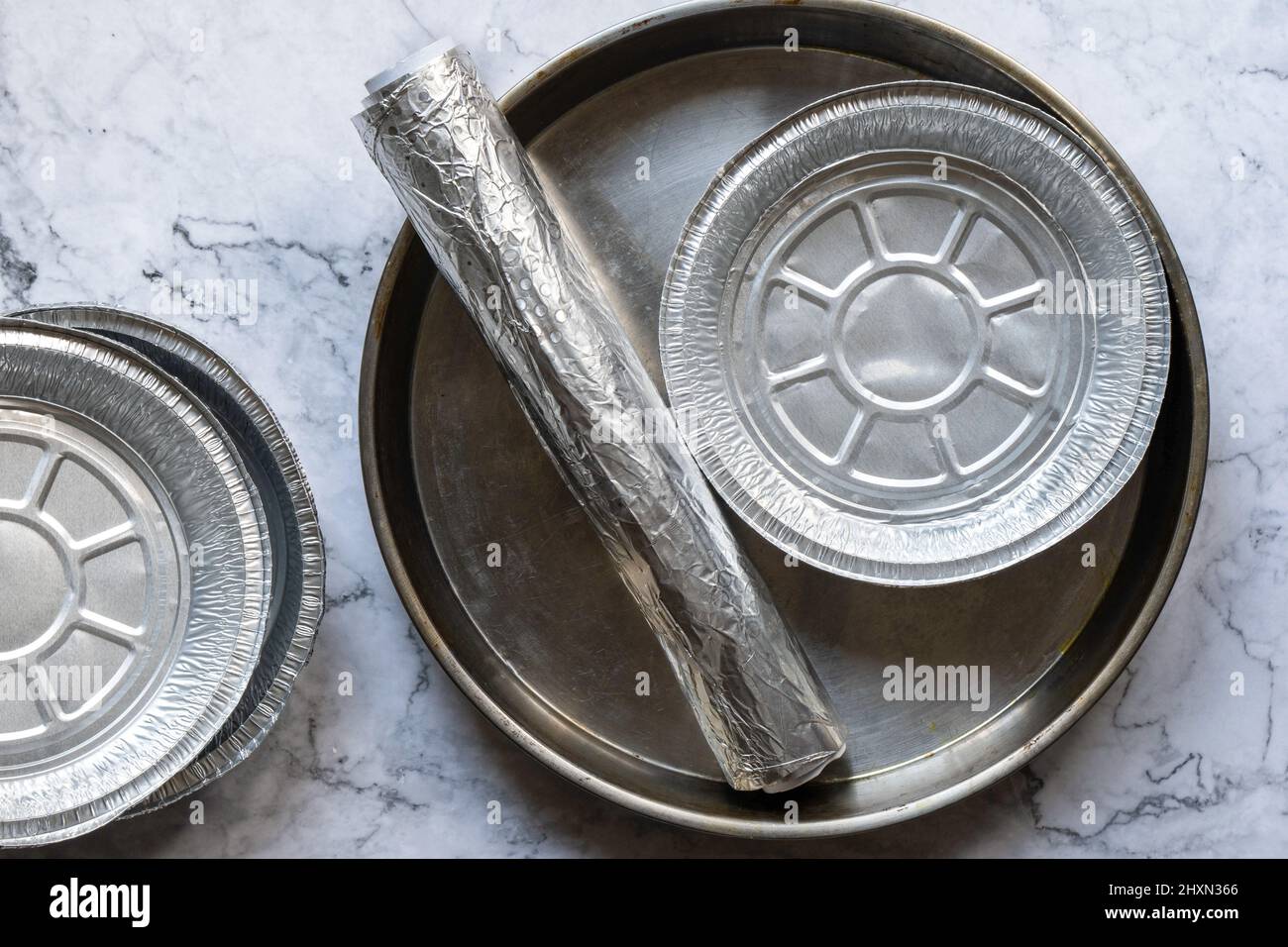 Aluminium foil, tray and casseroles. Recycling concept Stock Photo - Alamy