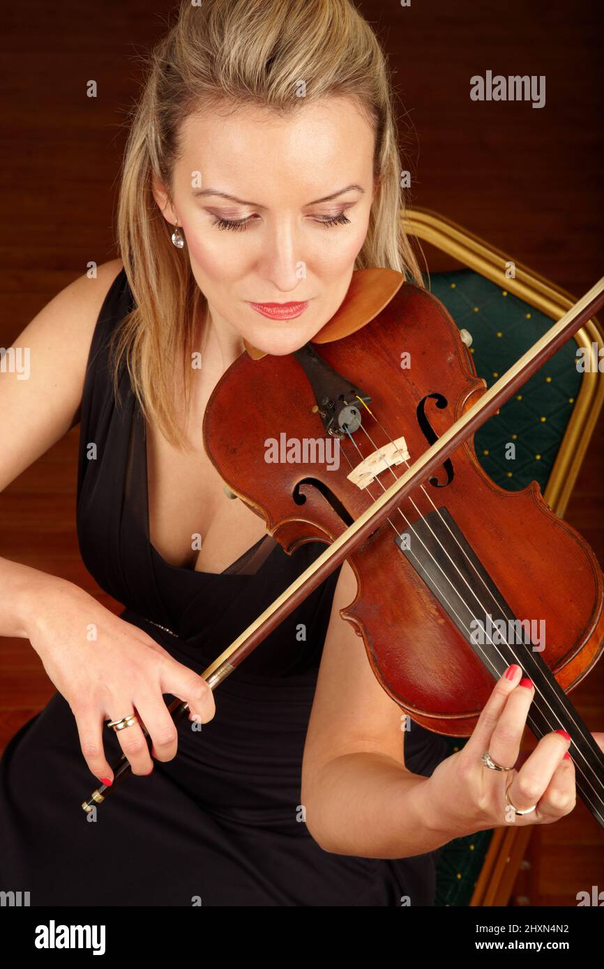 Beautiful woman playing violin hi-res stock photography and images - Alamy