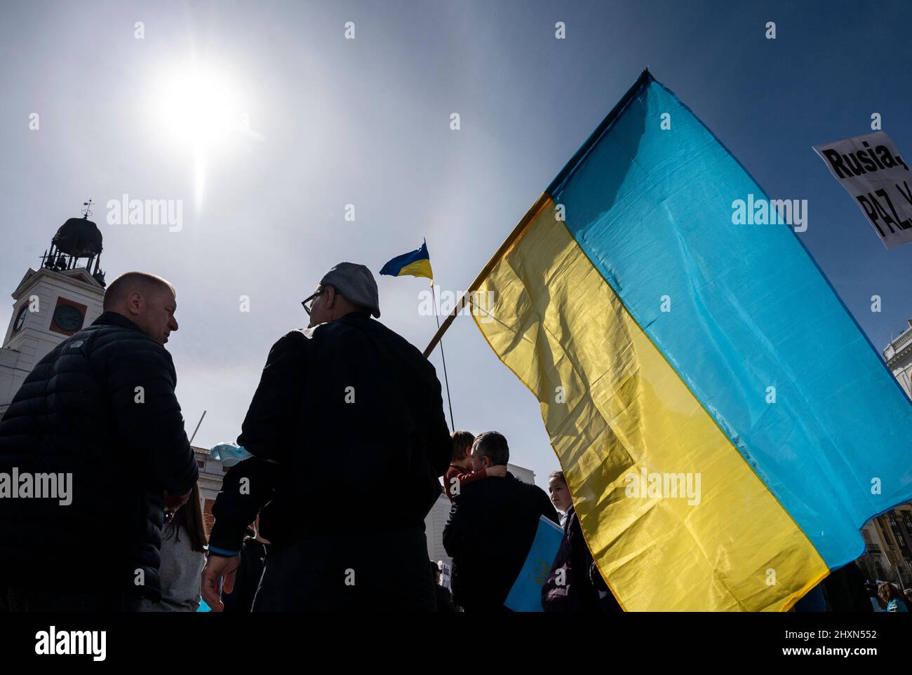 Madrid, Spain. 13th Mar, 2022. A protester holds a Ukrainian flag ...