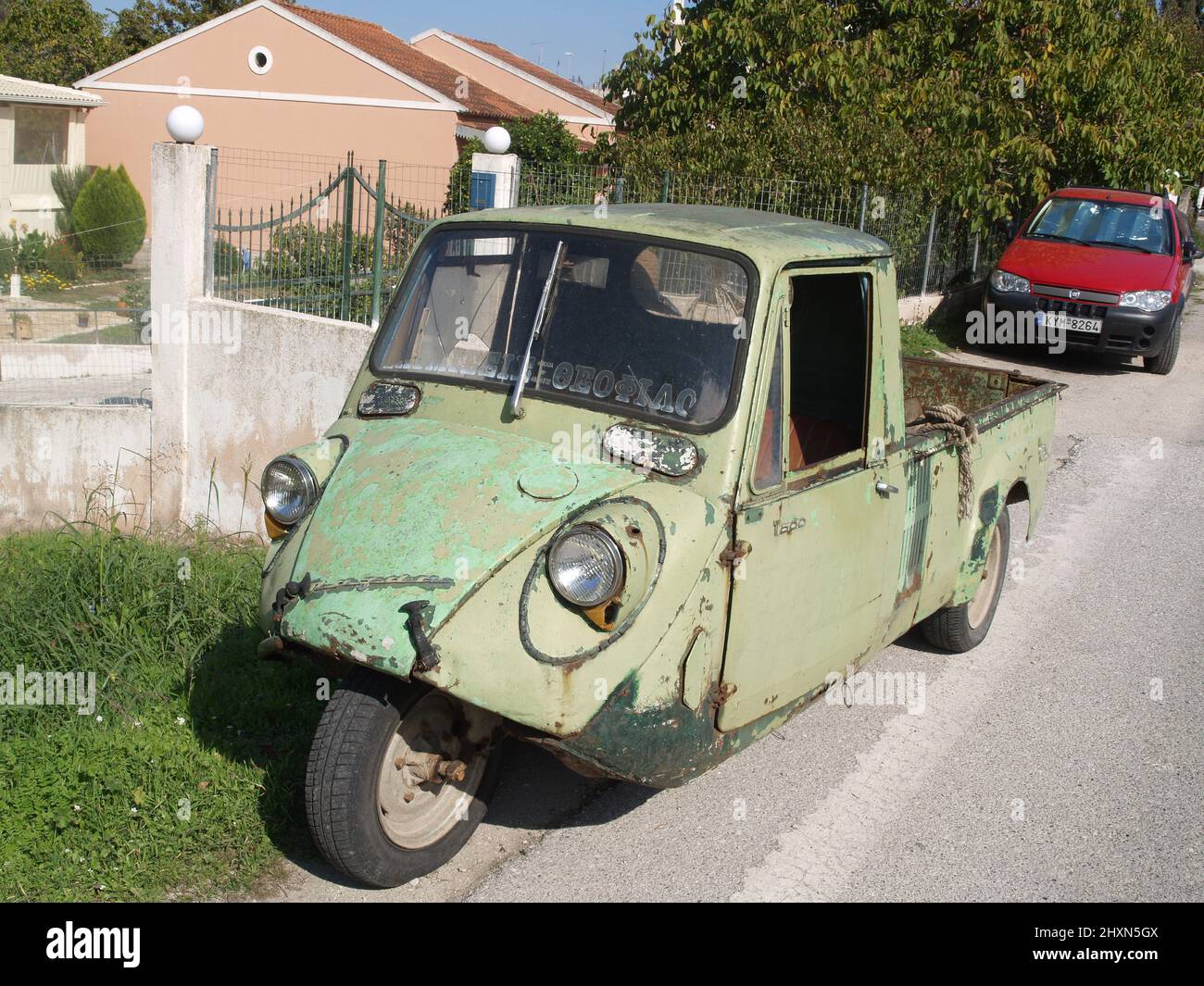 Rusty old Mazda K360 3 whhel truck still in use in Corfu Greece Stock ...