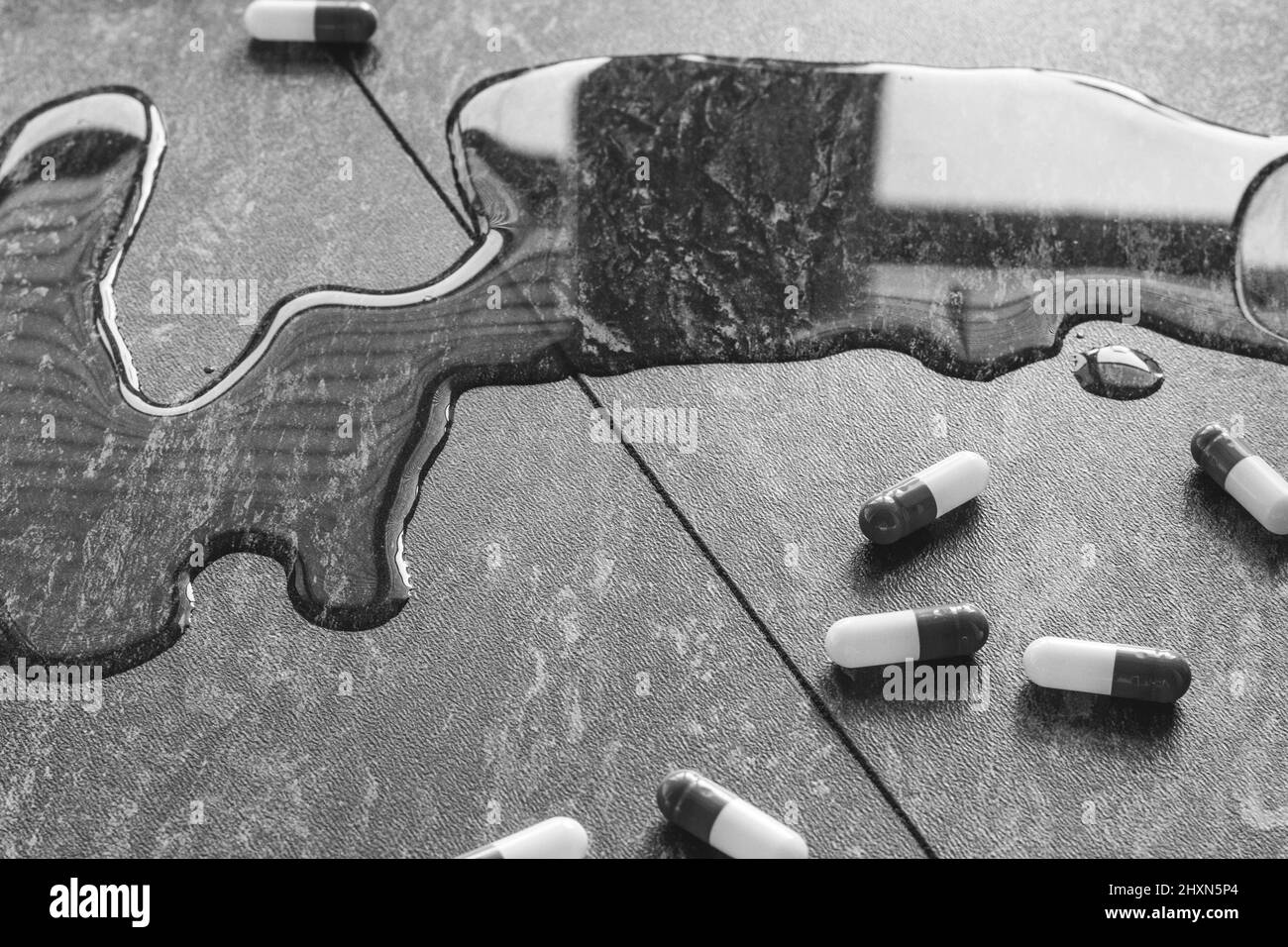 Medical pills fall from glass hi-res stock photography and images - Alamy