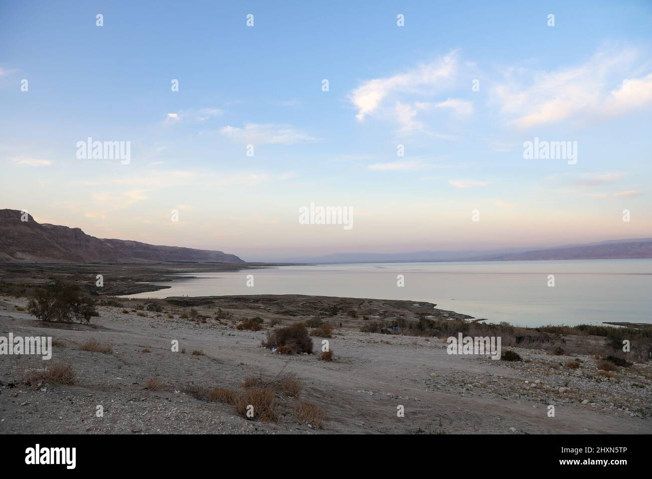 View of the vibrant sunset looking towards the horizon at the Dead Sea ...