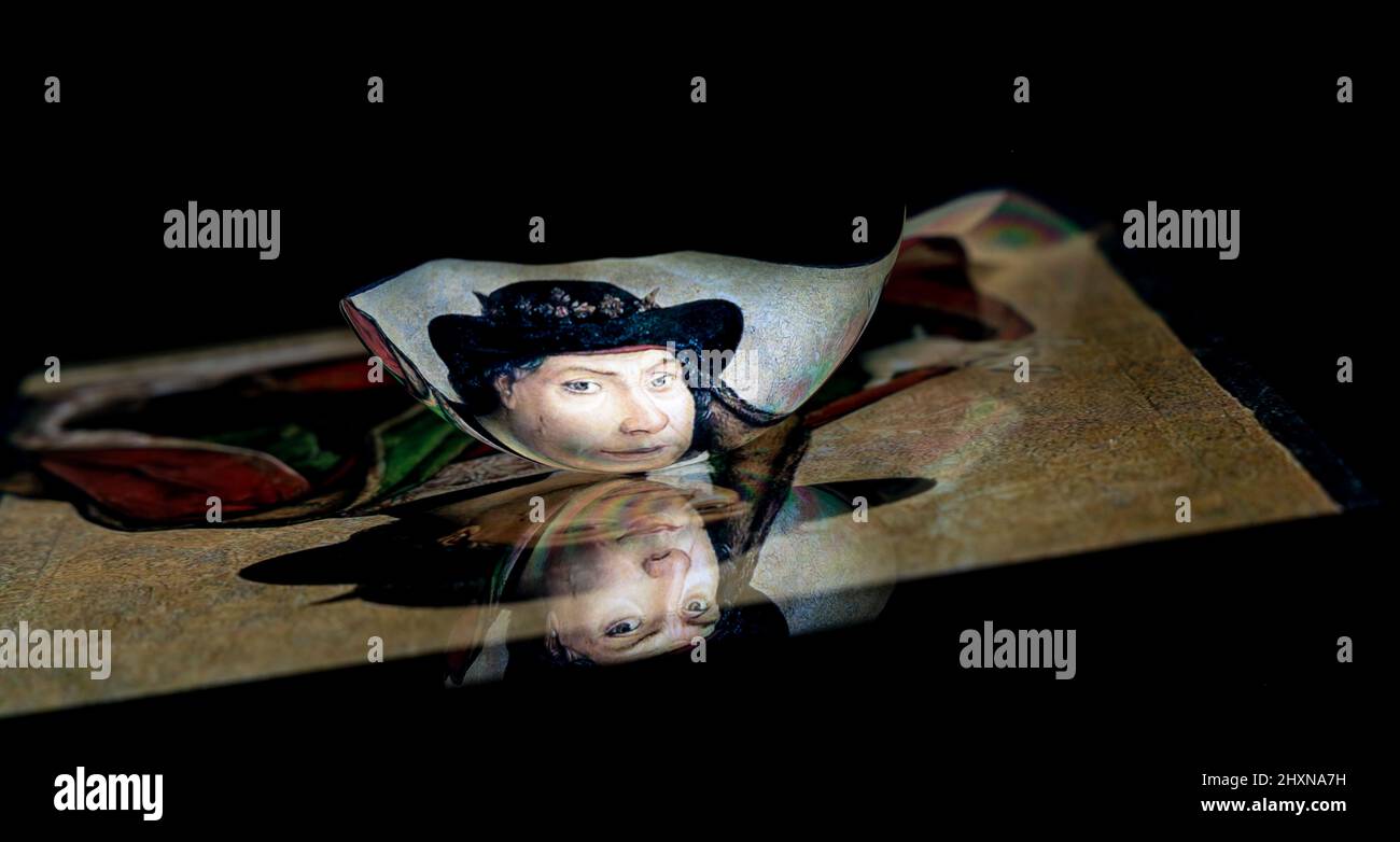 A classic renaissance portrait reflect from a tablet surface into a ...