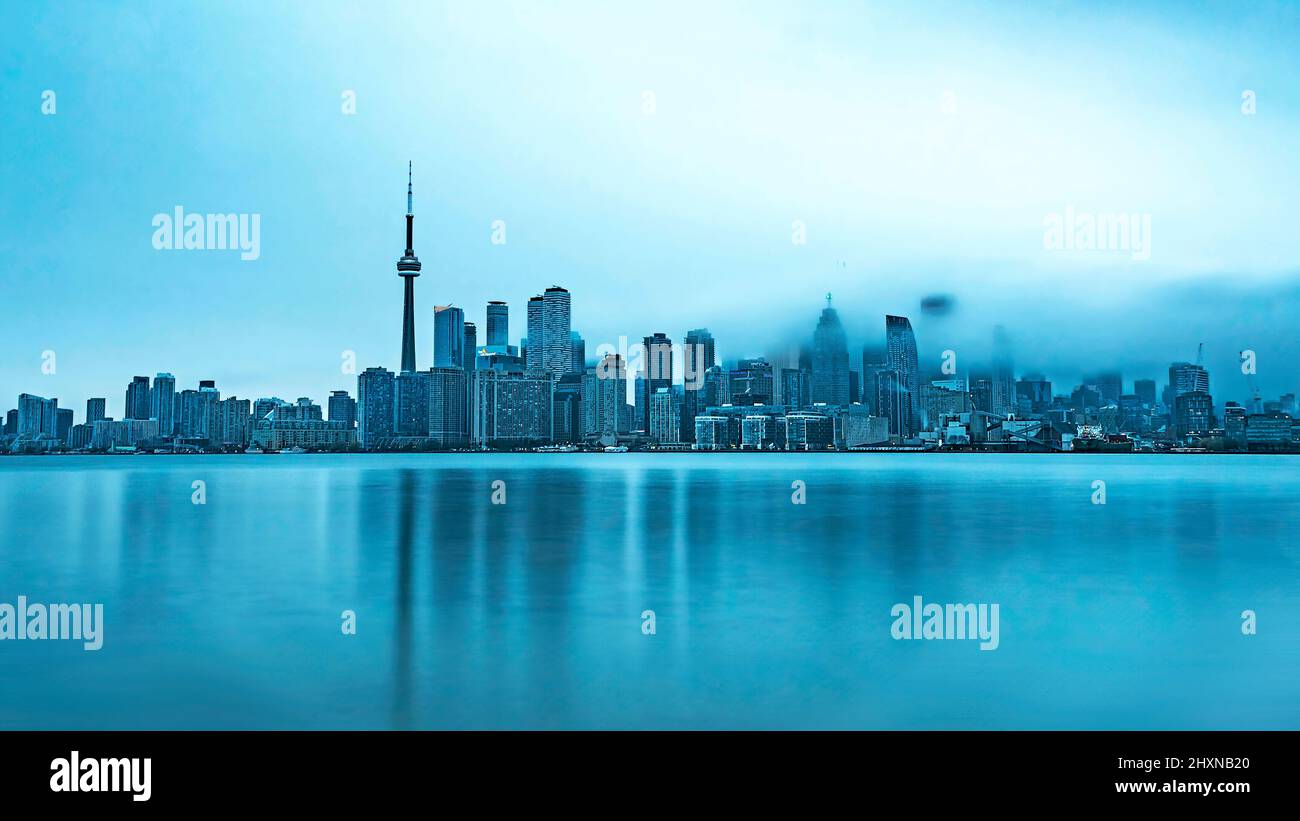 Skyline of Toronto (ON) Canada under extreme cold temperature at dawn ...
