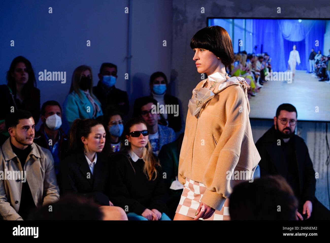 Lisbon, Portugal. 13th Mar, 2022. A model walks the runway during ...