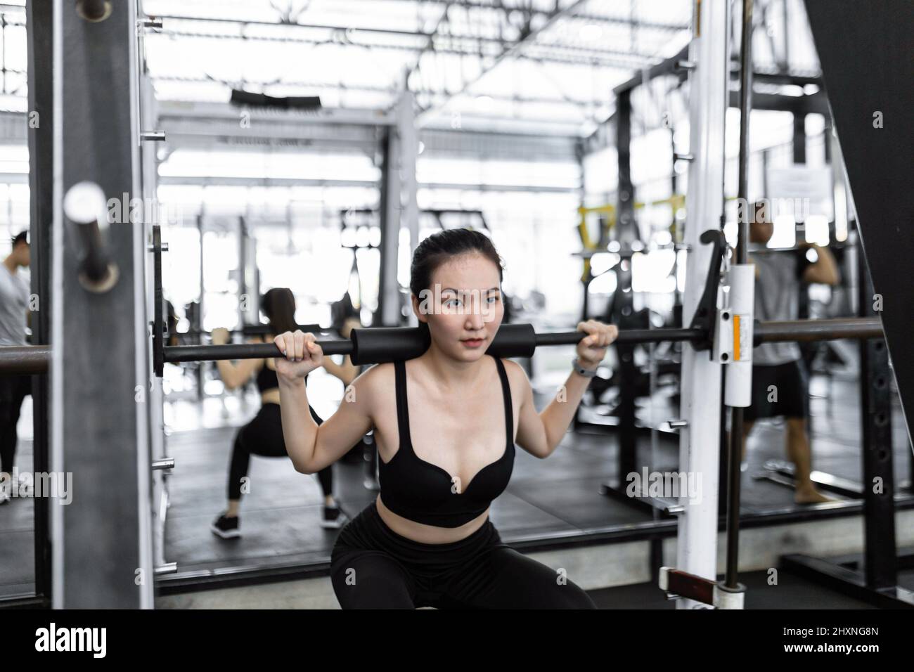 exercise concept The woman in black sport outfits carrying doing weight ...