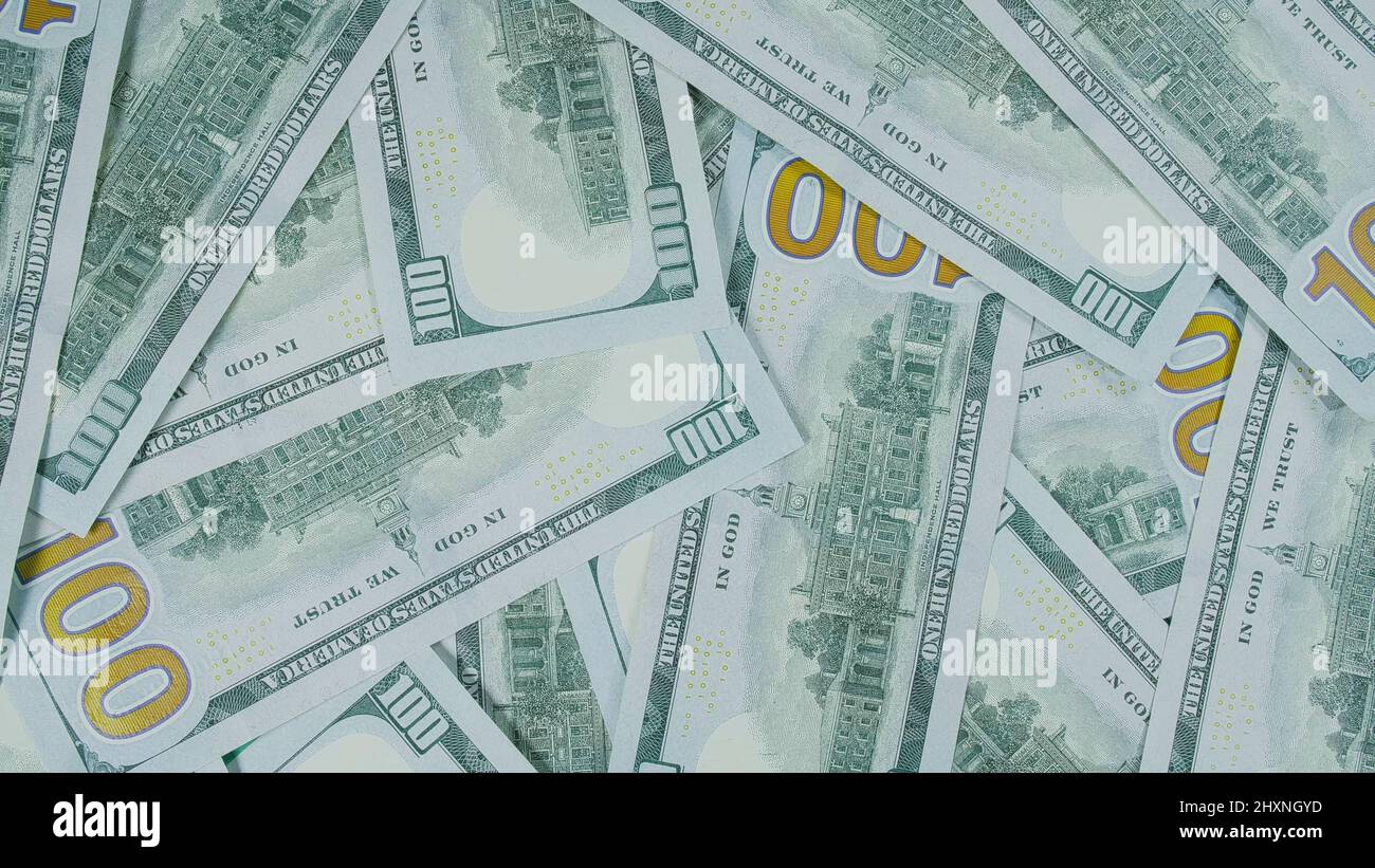 Many dollar are arranged around the edges of the image as a frame ...