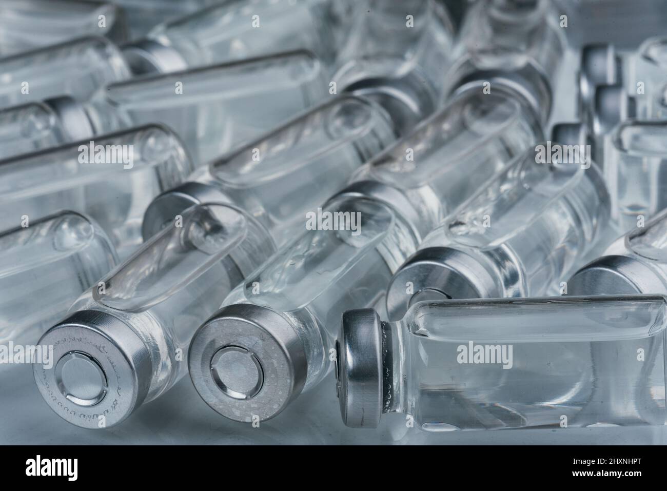 Glass medical ampoule vial for injection. Medicine is dry white drug ...