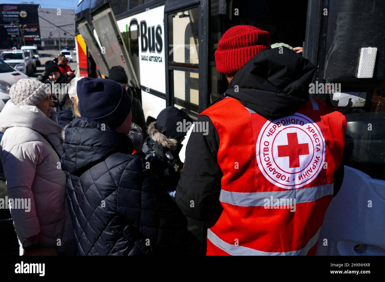 Odesa, Ukraine, March 12, 2022. People stand next to an evacuation bus ...