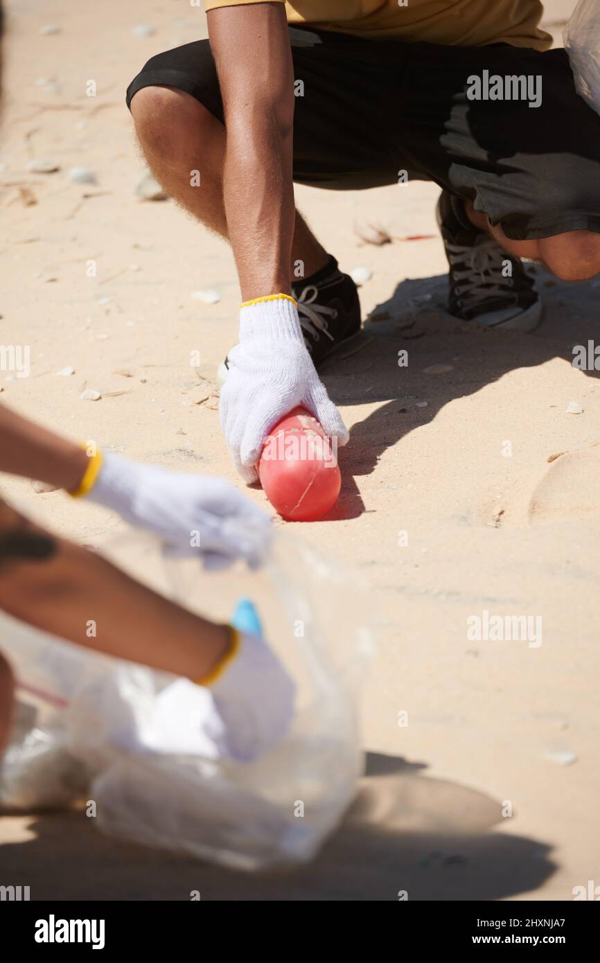 Plastic waste beach hands hi-res stock photography and images - Alamy