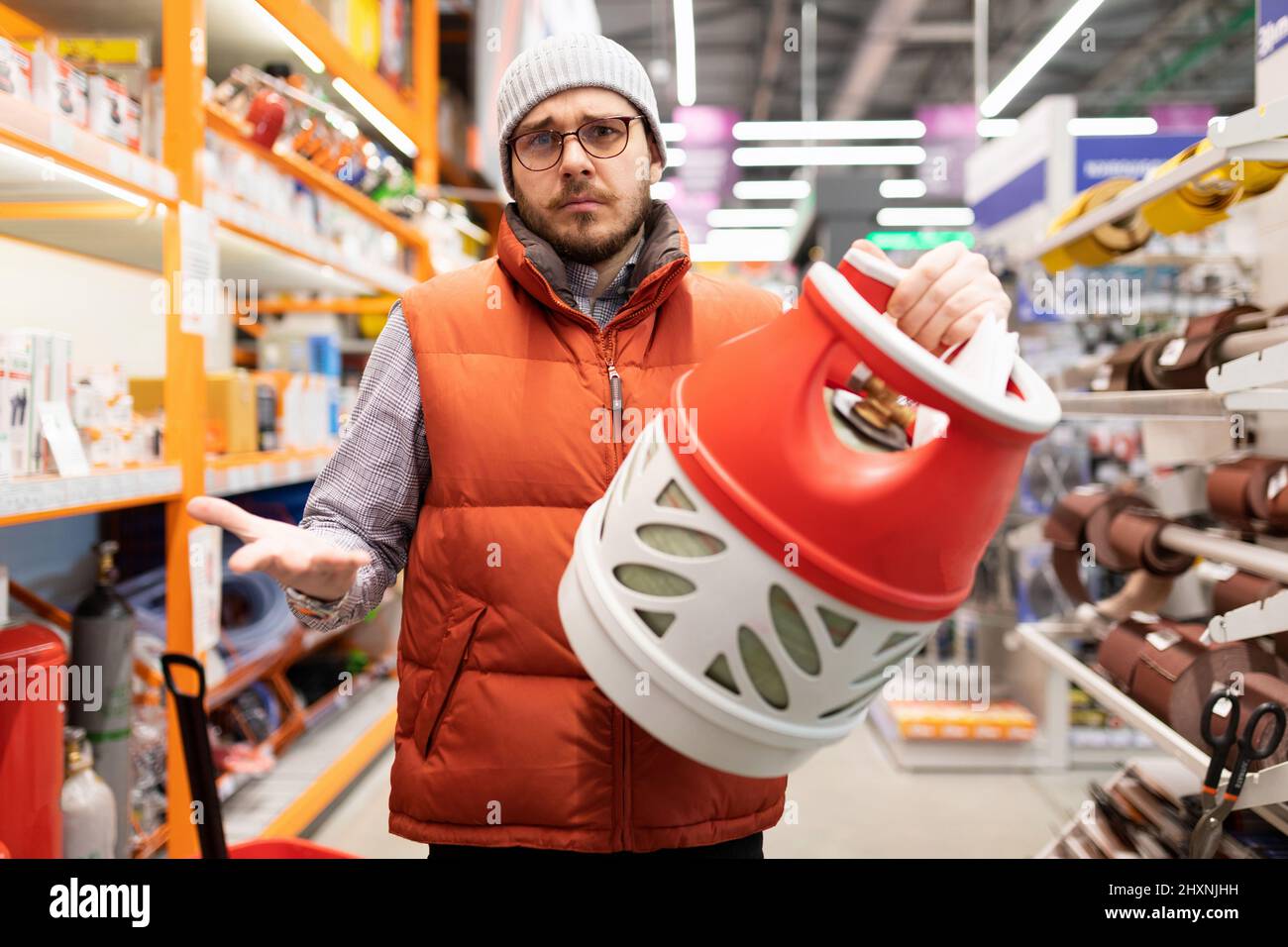 Handsome guy selecting bottle hi-res stock photography and images - Alamy