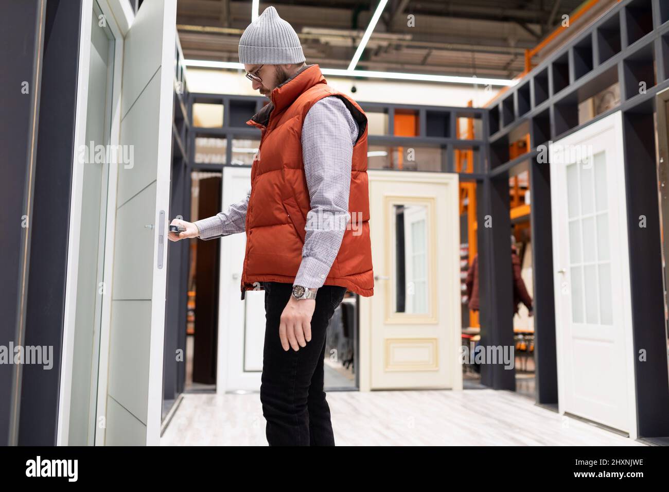 hardware store customer chooses interior doors Stock Photo - Alamy