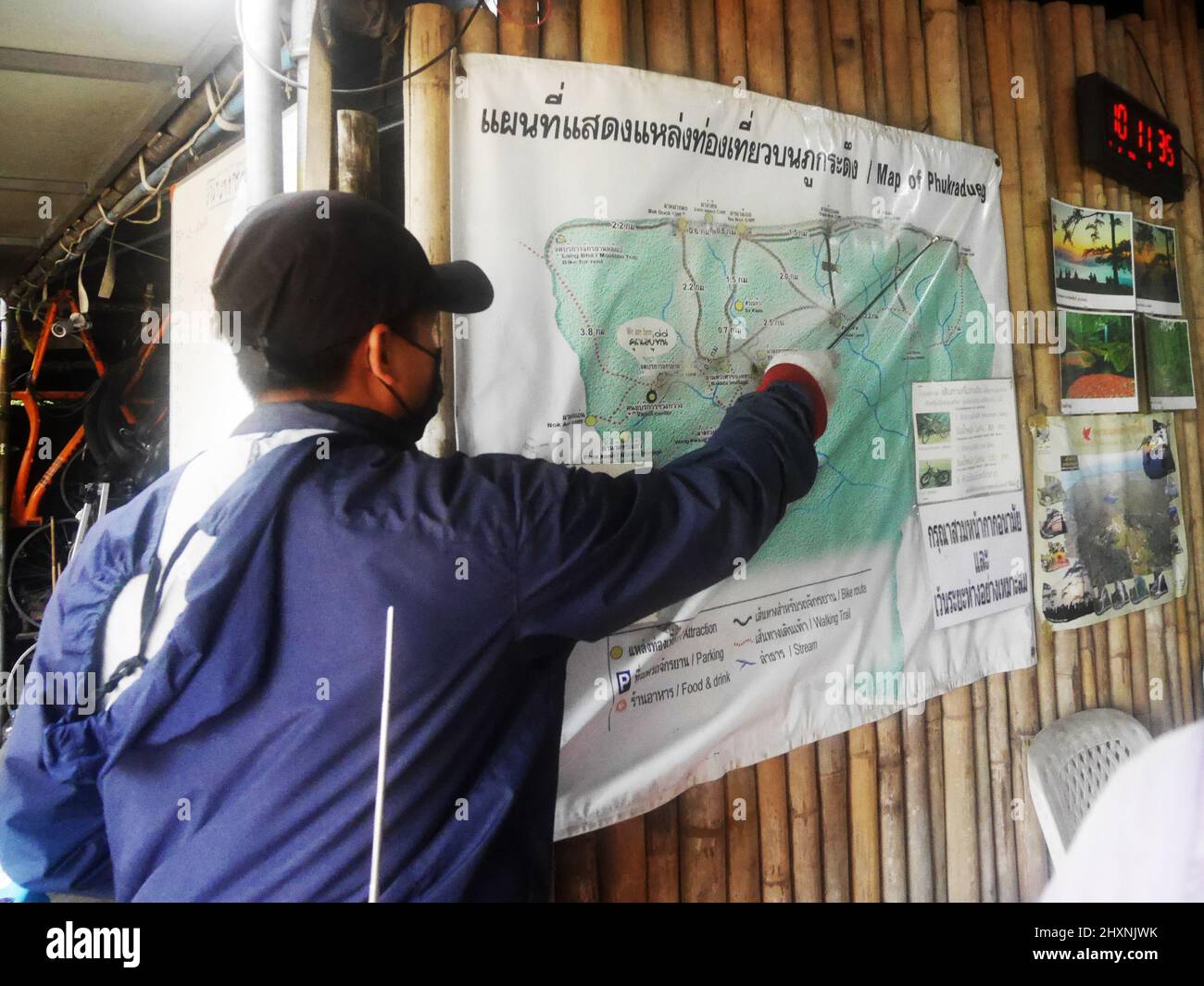 Park ranger officer explain detail map information for travelers thai ...