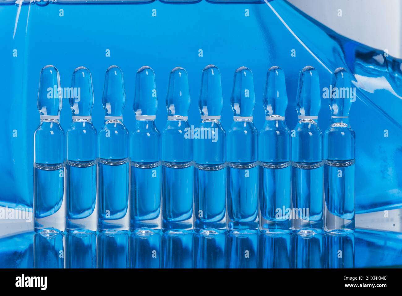 Glass medical ampoule vial for injection. Medicine is liquid sodium ...