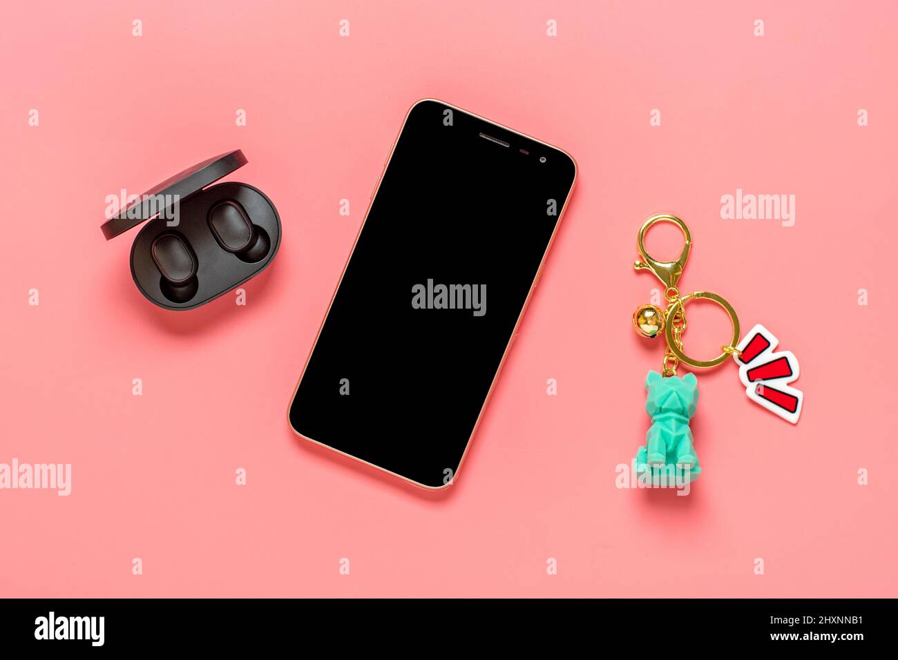 Smartphone with black screen and wireless headphones redmi airdots ...
