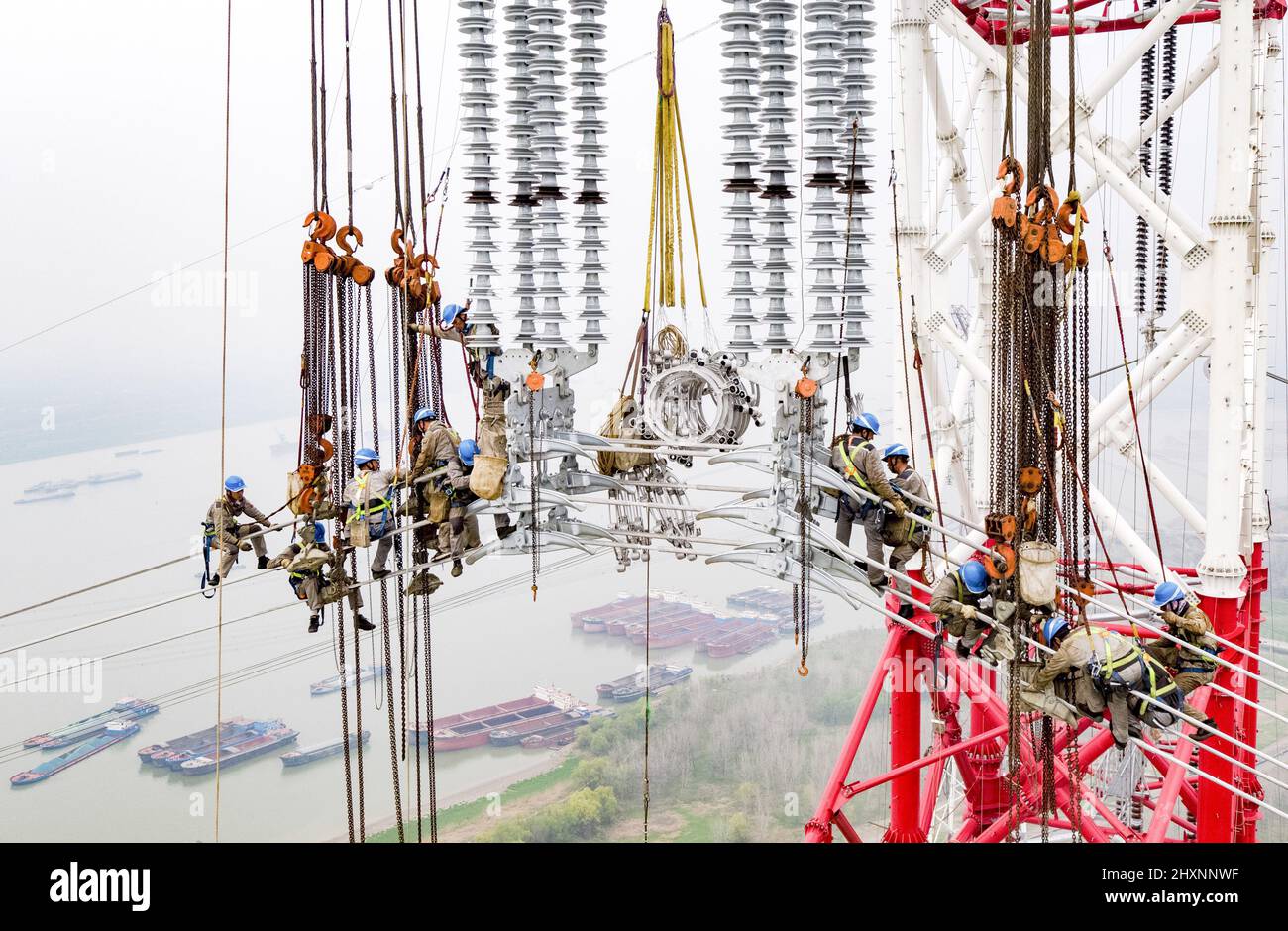 WUHU, CHINA - MARCH 14, 2022 - Construction workers cross the Yangtze ...