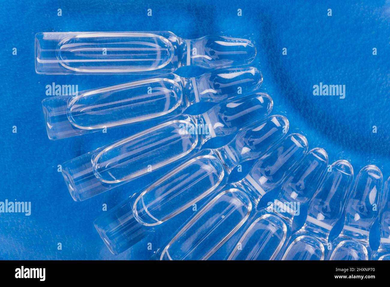 Glass medical ampoule vial for injection. Medicine is liquid sodium ...