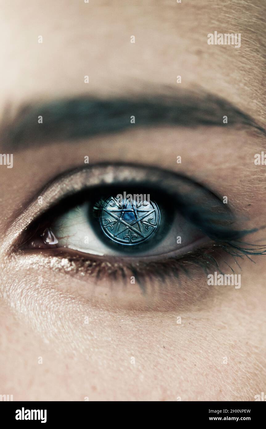 woman eye with a pentacle inside her eye Stock Photo - Alamy